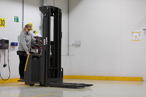 Optimise Your Warehouse Operations with the SRS Ride-On Stacker Truck | TCM
